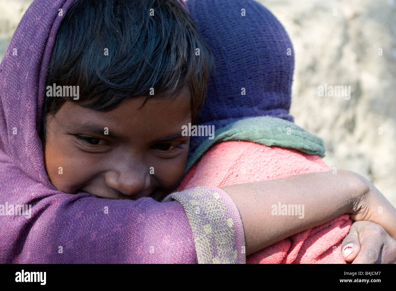 A tribal girl shares a happy moment with his brother at a tribal ...