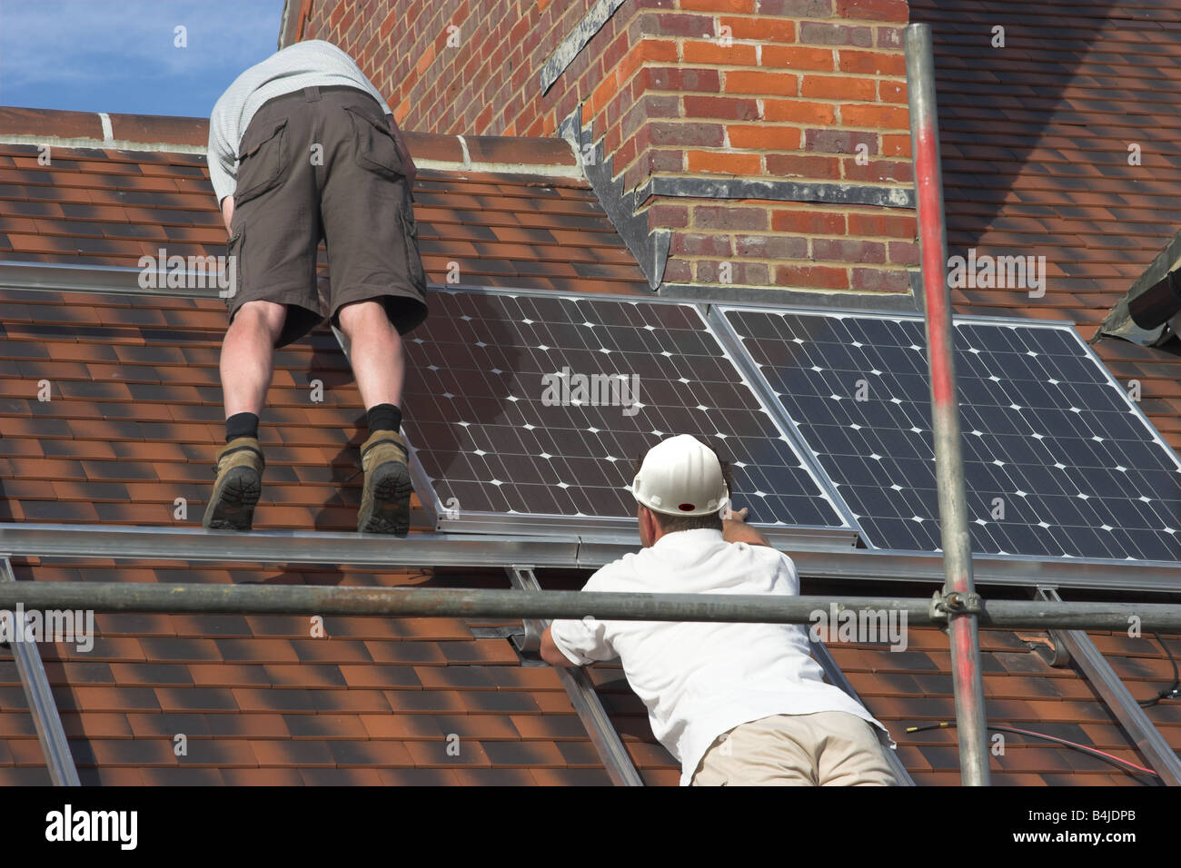 Installation of a photovoltaic solar power system on private house near ...