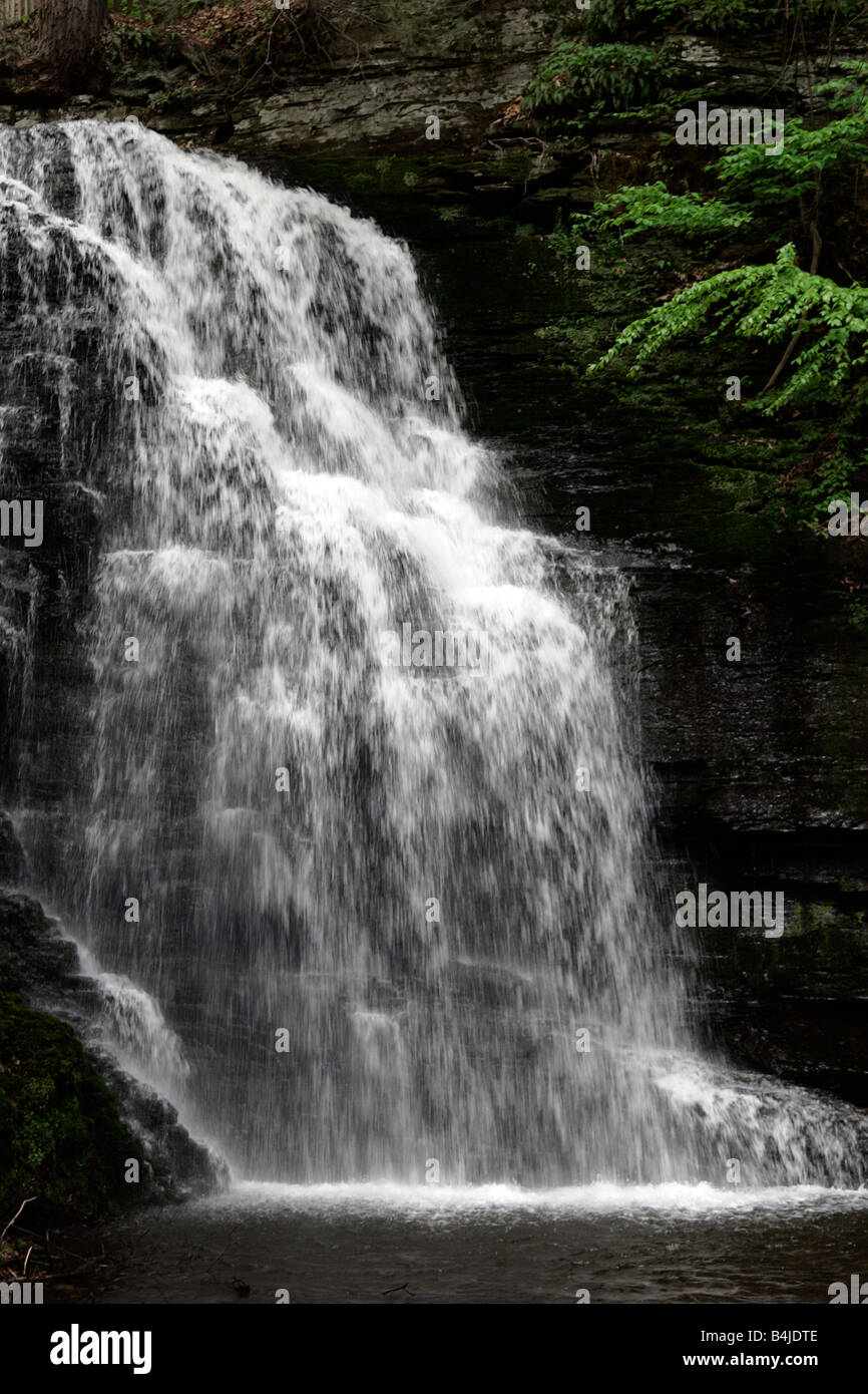 A waterfall cascading into a lake Stock Photo - Alamy