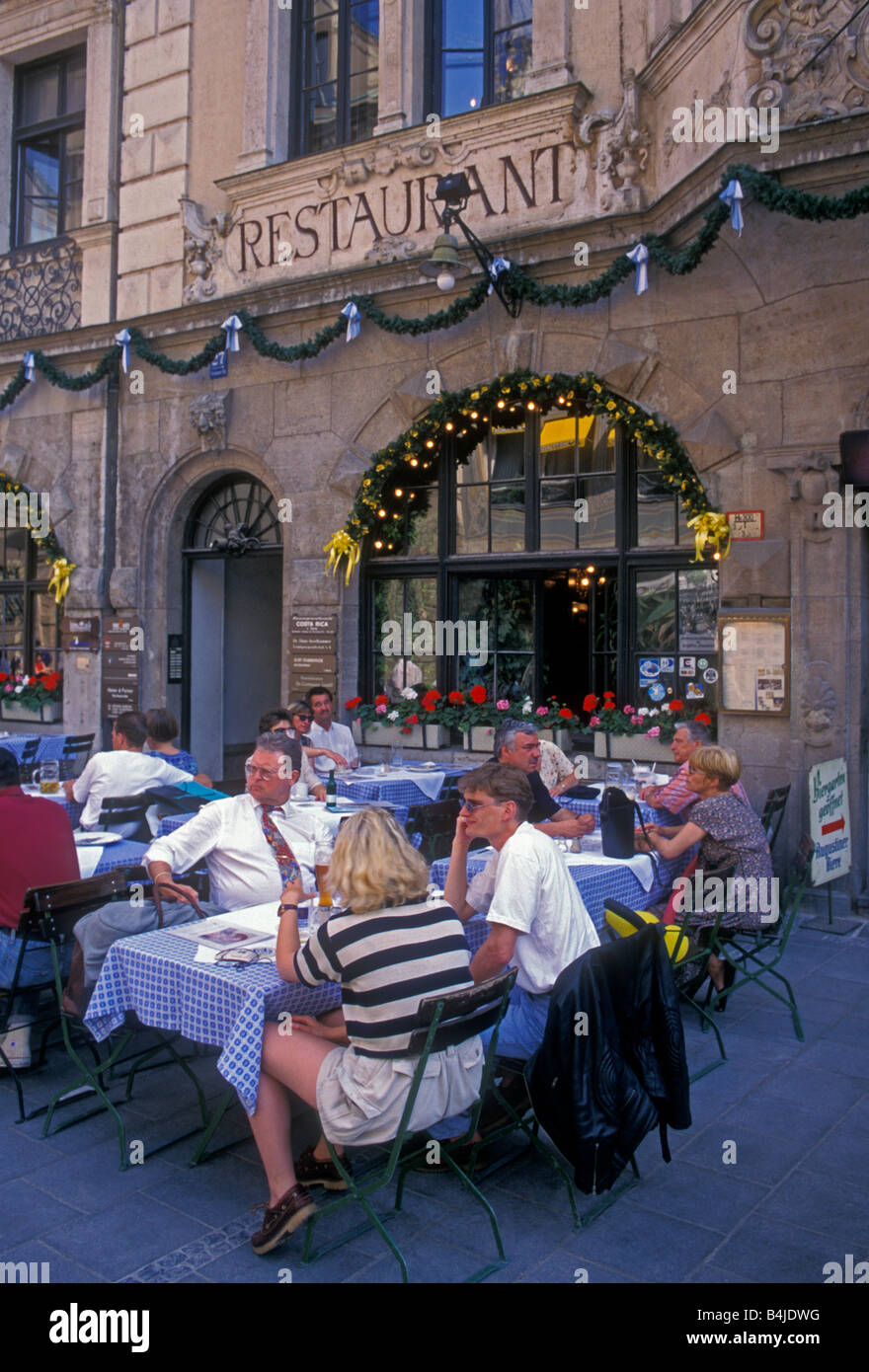 German people, family, eating lunch, outdoor dining, table service ...