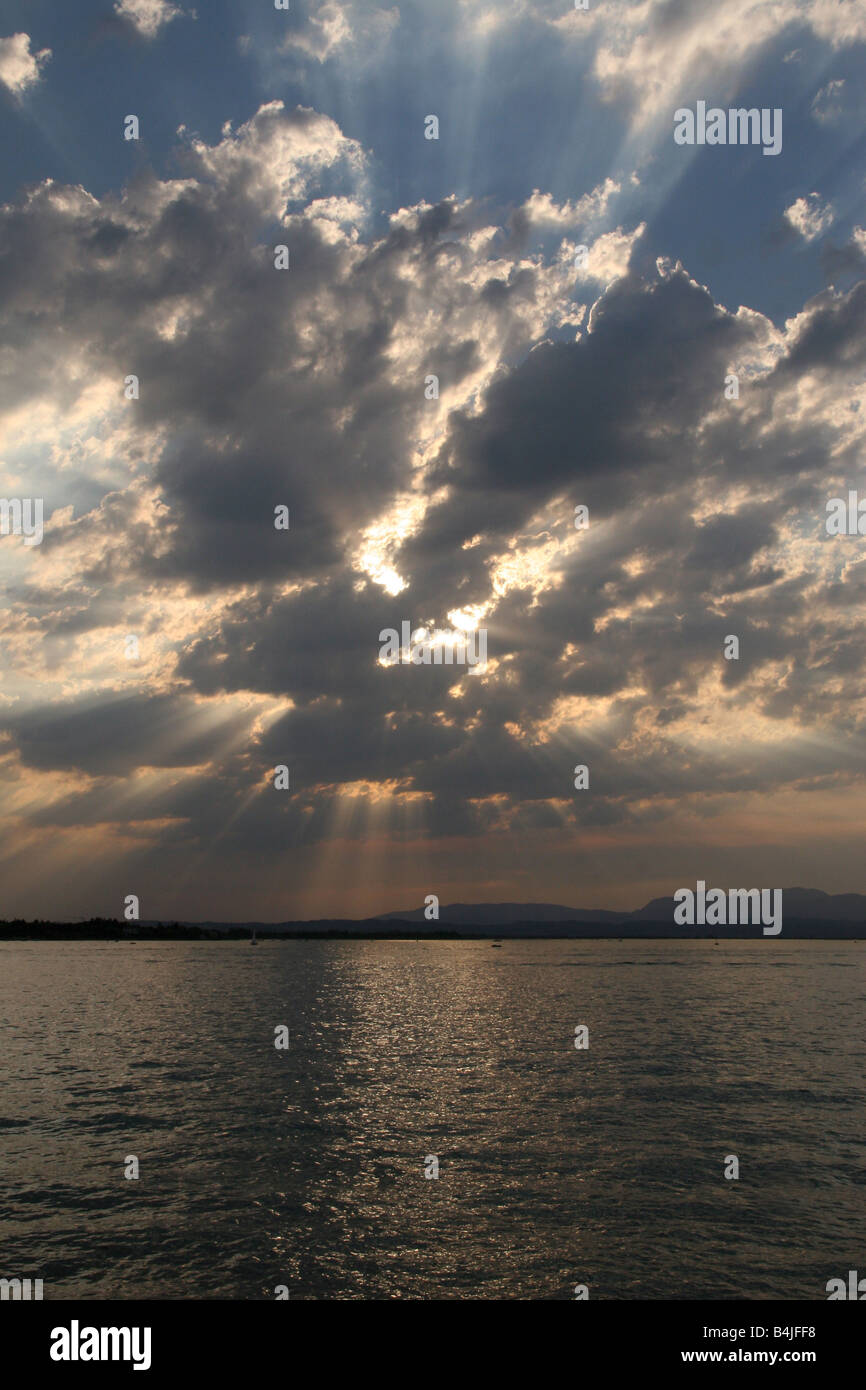 Sun breaking clouds over lake hi-res stock photography and images - Alamy