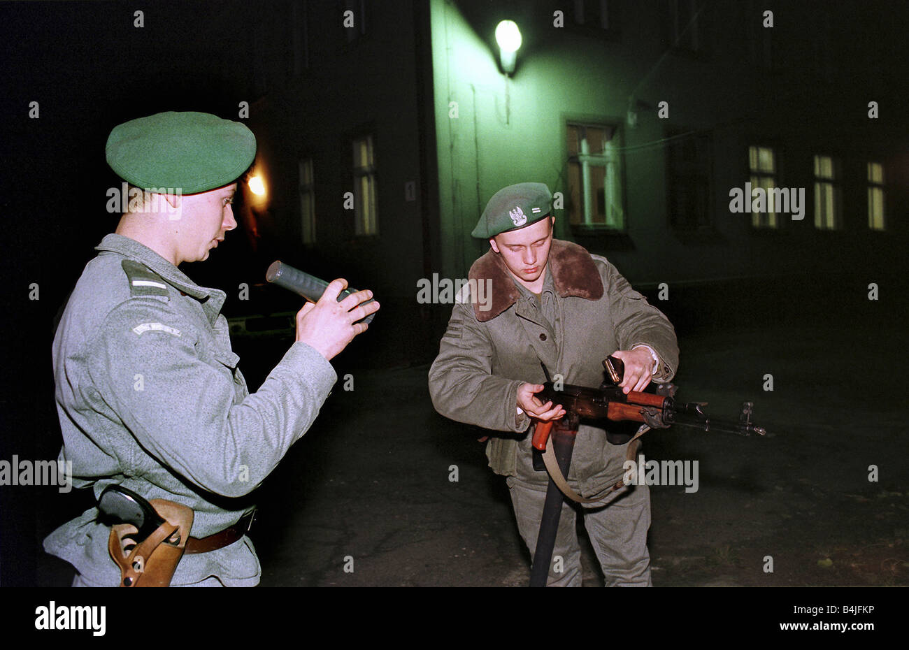 Polish border guard officer practicing shooting at night, Poland Stock ...