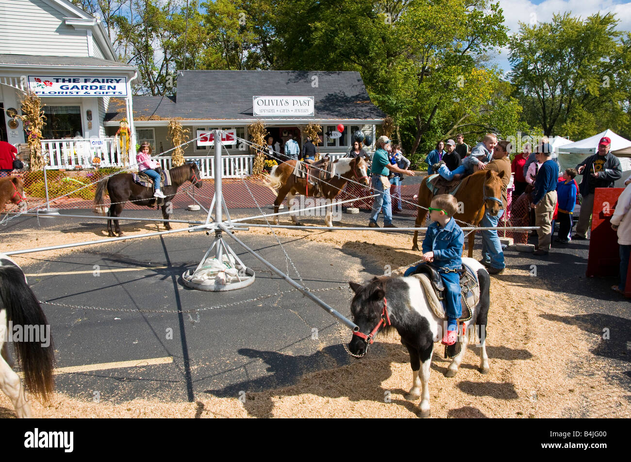 Kids Pony Ride at Festival Stock Photo - Alamy