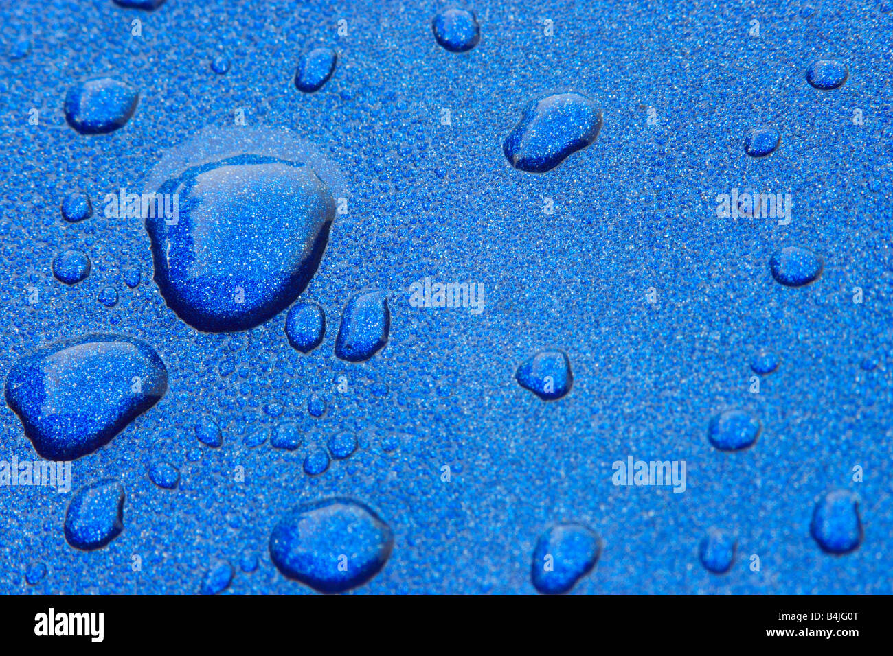 Morning dew on blue surface Stock Photo - Alamy