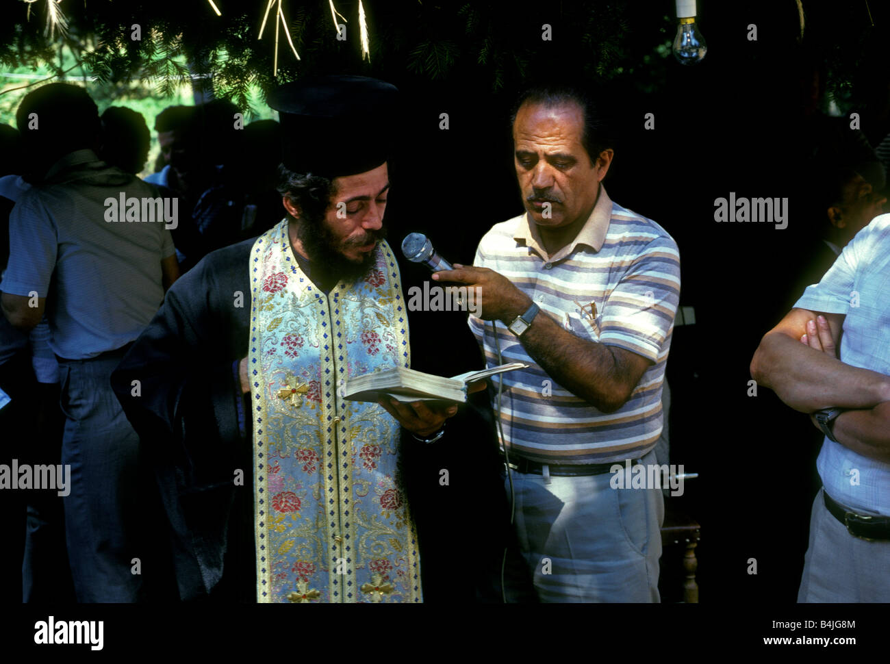 Greek orthodox priest, reading bible, outdoor mass, religious service ...