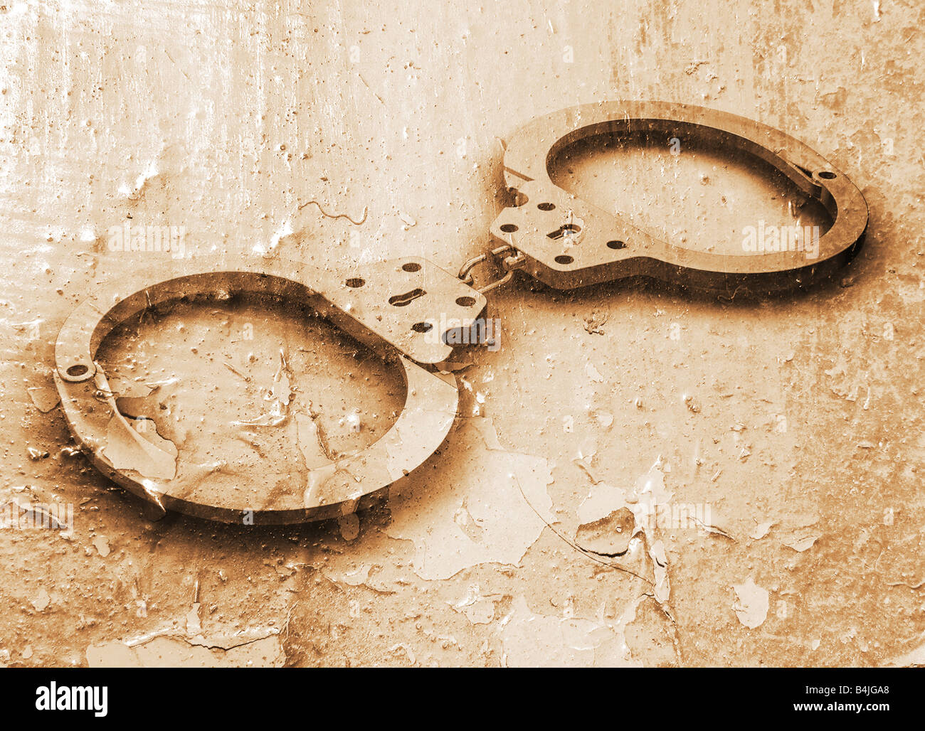 Handcuffs on grunge background Stock Photo - Alamy