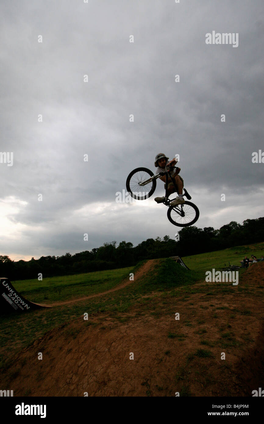 BMX biker performing tricks and jumping a large ramp Stock Photo - Alamy