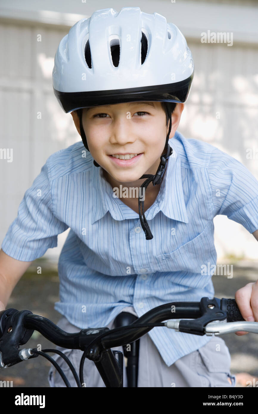 Asian boy riding bicycle Stock Photo - Alamy