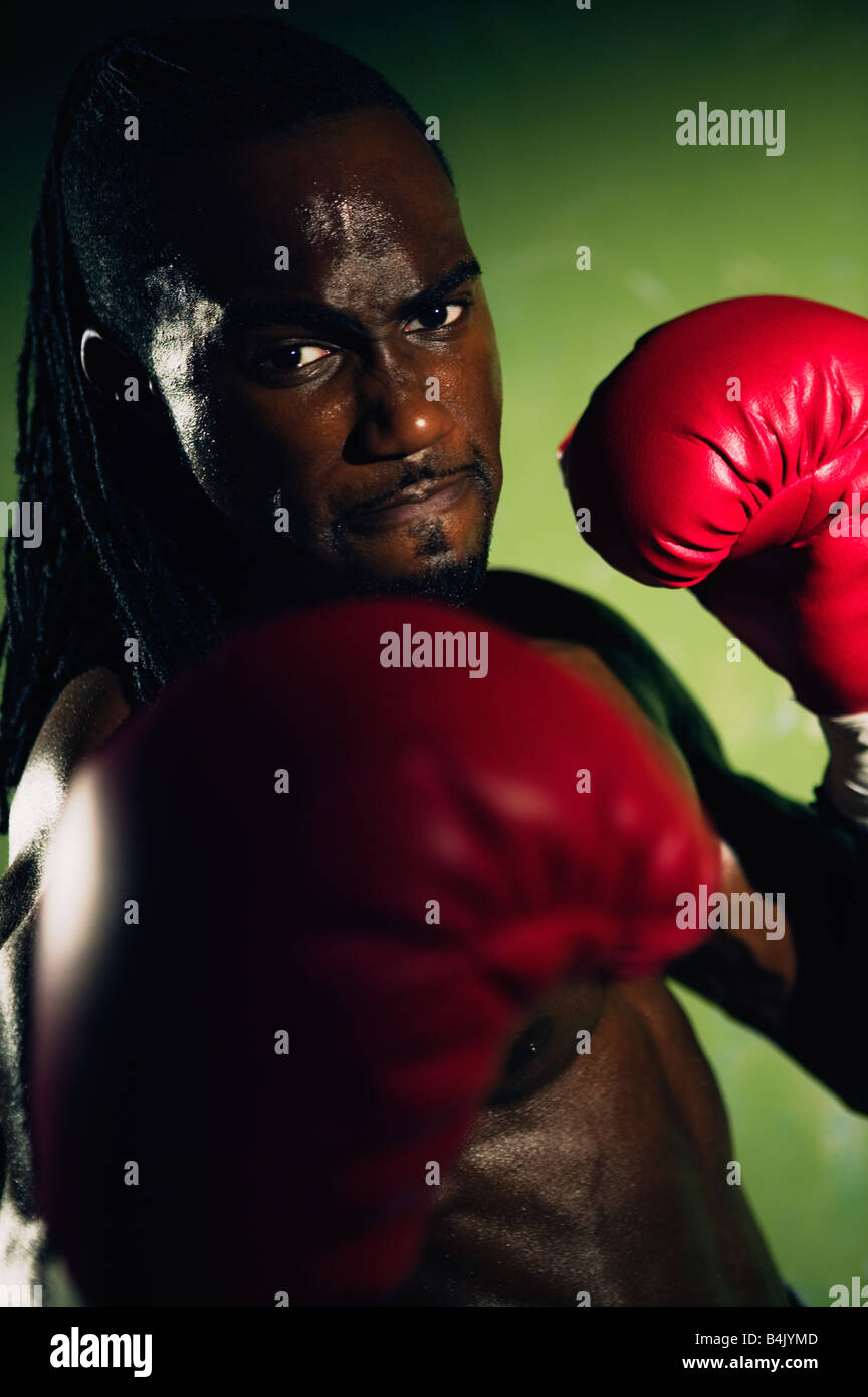 African male boxer punching Stock Photo - Alamy
