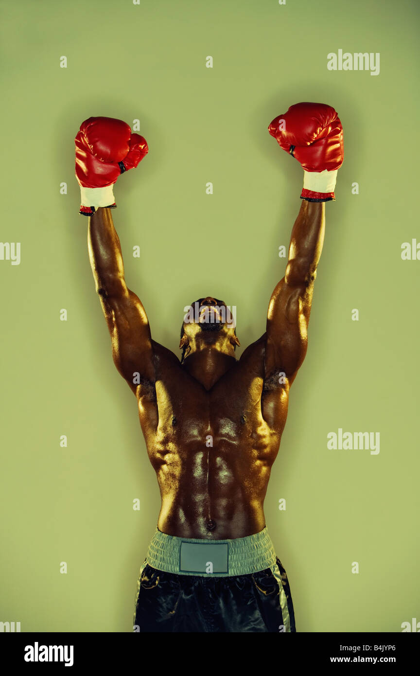 African male boxer with arms raised Stock Photo - Alamy