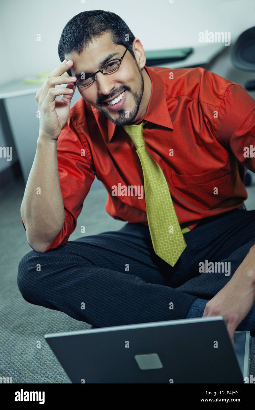 Hispanic businessman next to laptop Stock Photo - Alamy