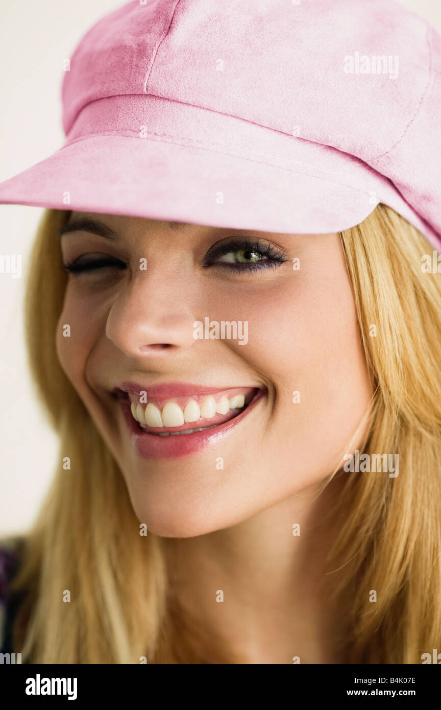 Smiling young blonde woman winking hi-res stock photography and images ...