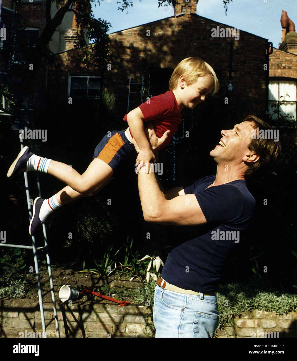 Timothy Bentinck Actor playing with his son Will Bentinck in his garden ...
