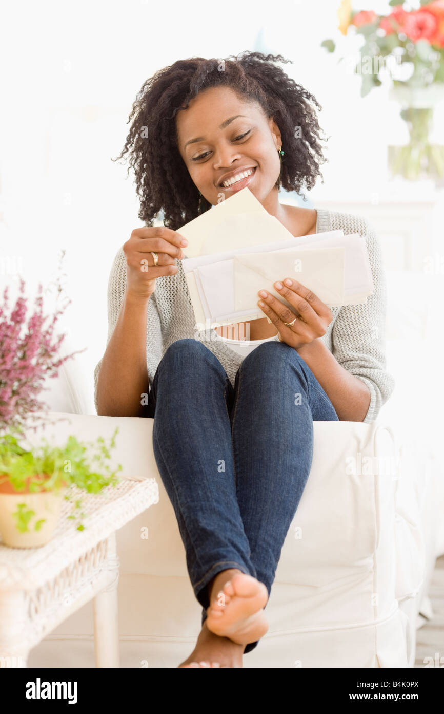 African woman reading mail Stock Photo - Alamy