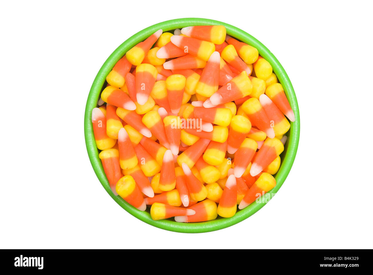 A bowl of candy corn isolated on a white background Stock Photo - Alamy