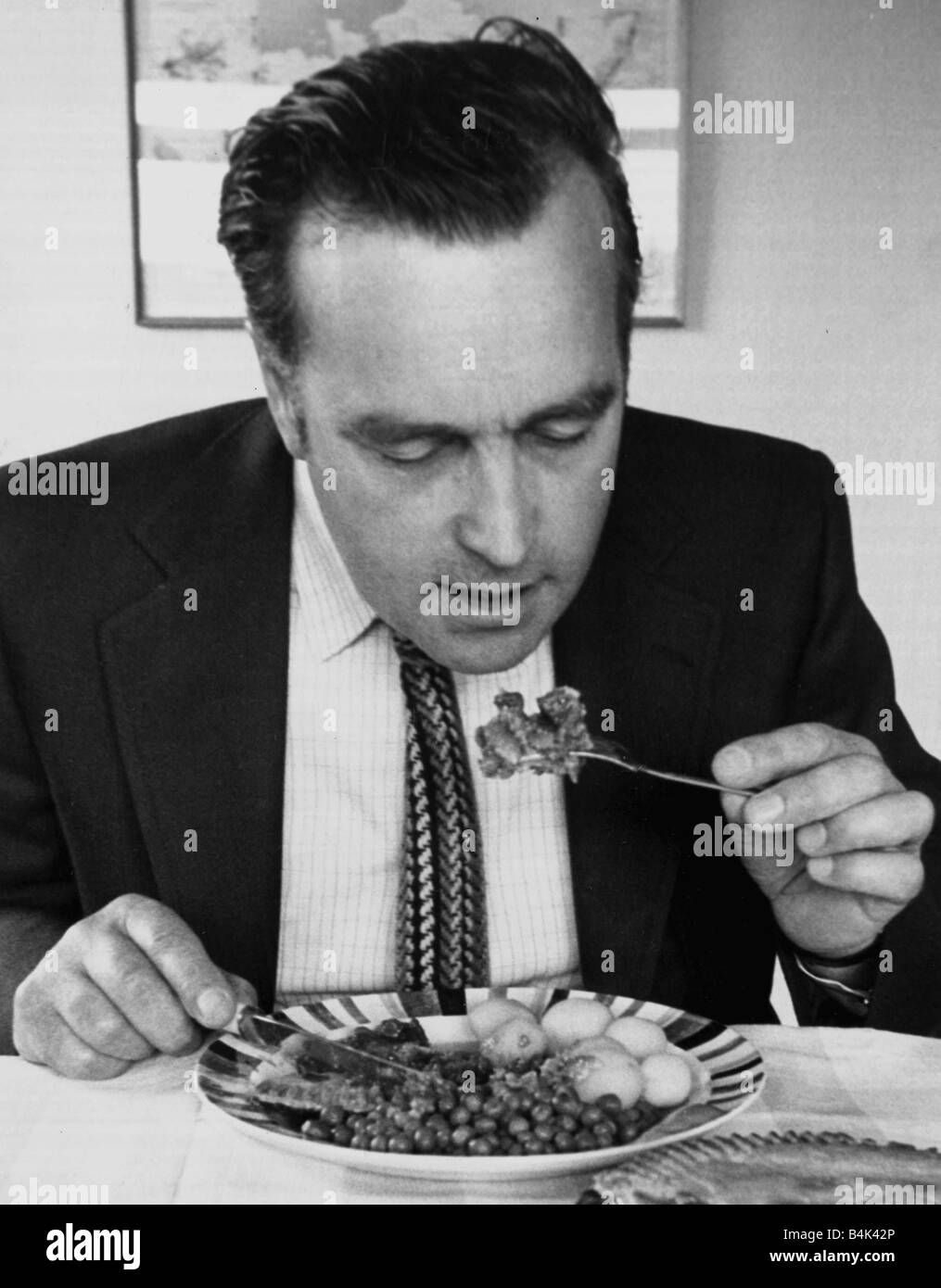 Journalist David Jack eating a meat lunch June 1975 1970s Stock Photo ...