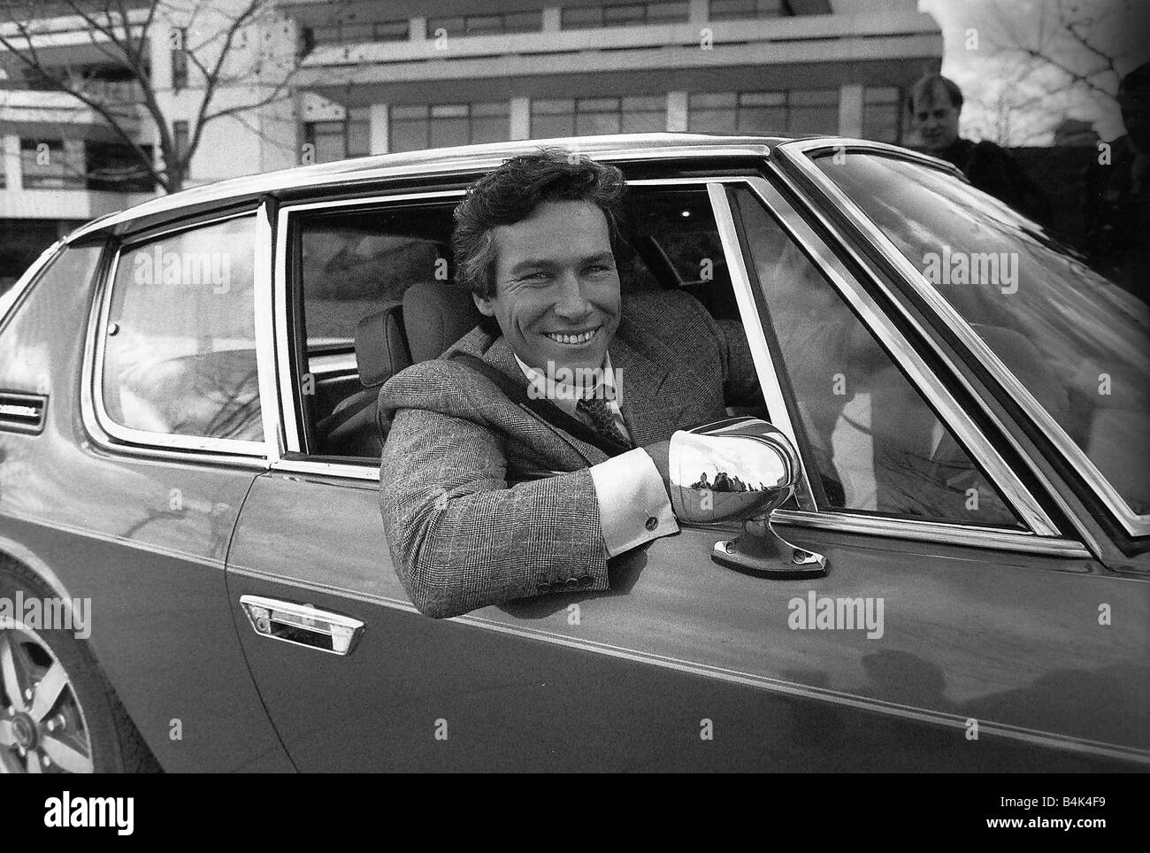 Simon Dutton Actor leans out of the window of an Aston Martin DBS ...