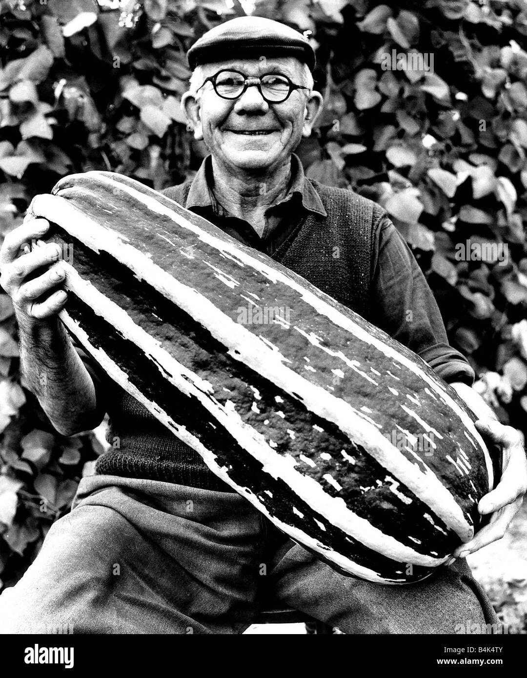 Tom Saunders with his Giant marrow Vegetables marrow Stock Photo - Alamy
