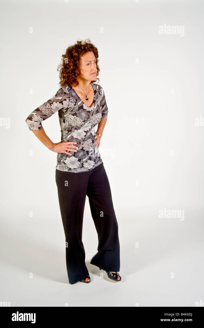 Standing with hands on her hips indicates readiness and aggression via ...