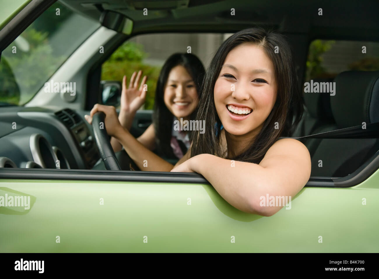 Two girls posing in car hi-res stock photography and images - Alamy