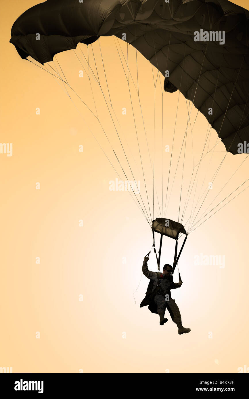 Soldier descending on parachute Stock Photo - Alamy