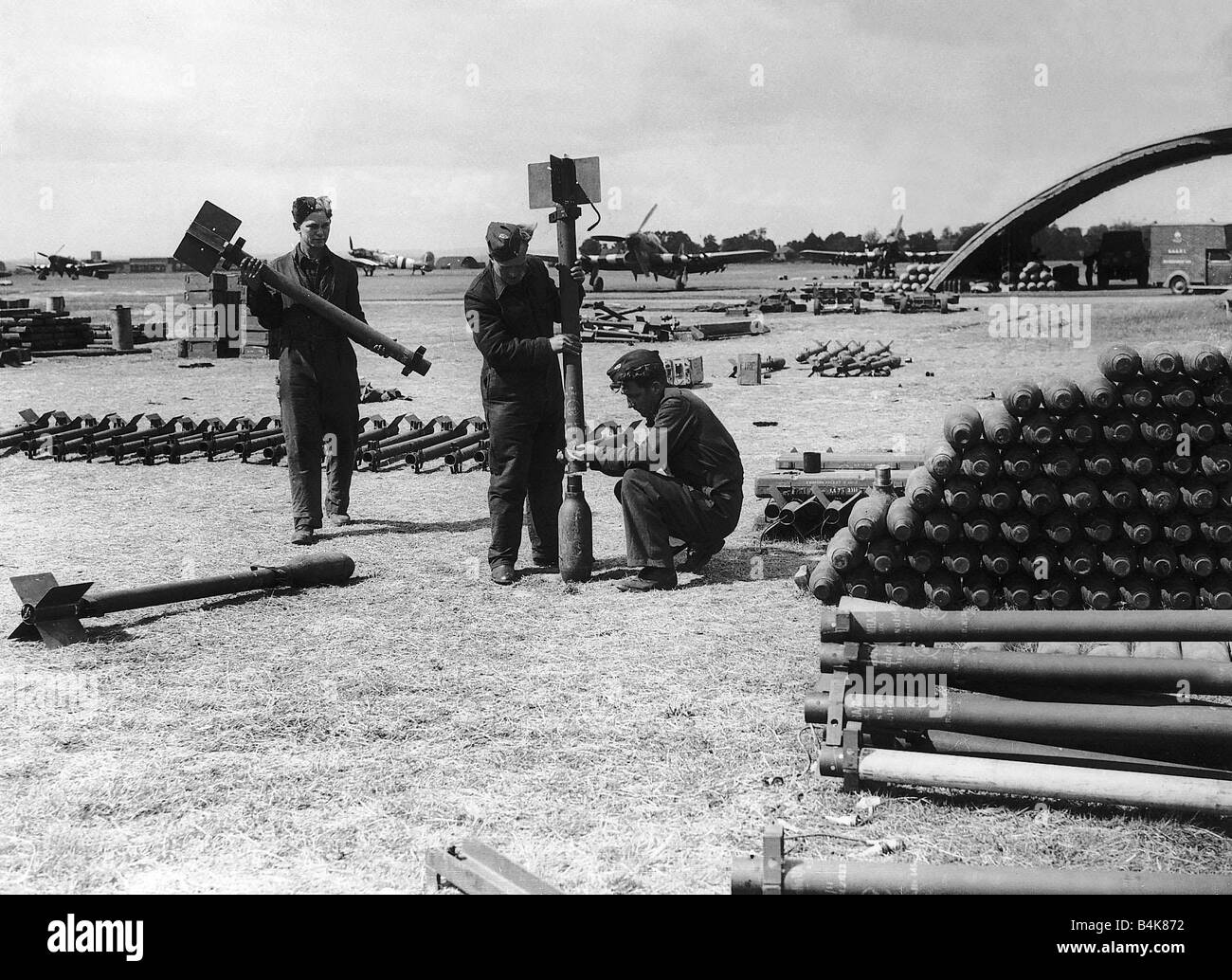 RAF armourers prepare rockets for Hawker Typhoon aircraft during WW2 ...