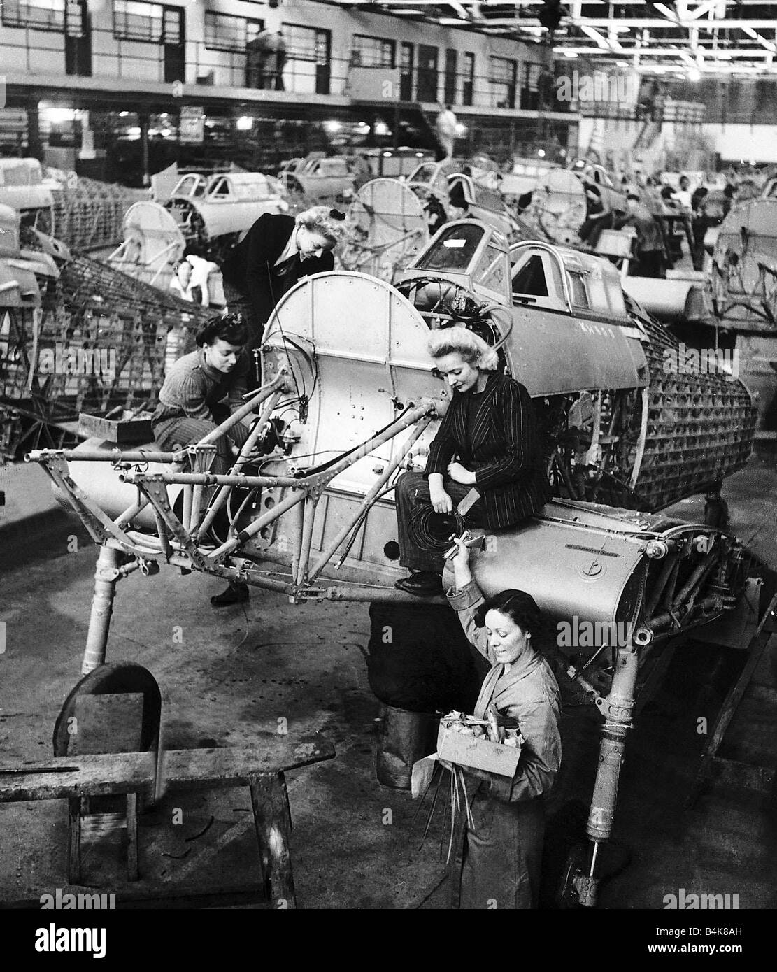 Women work on the production line of Hawker Hurricane aircraft during ...