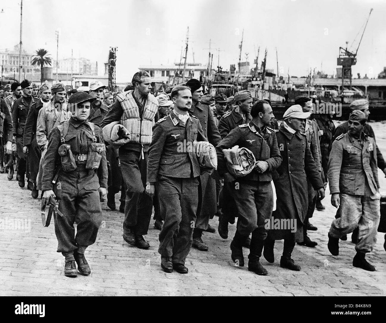 Prisoners captured in North Africa are marched through the docks at ...