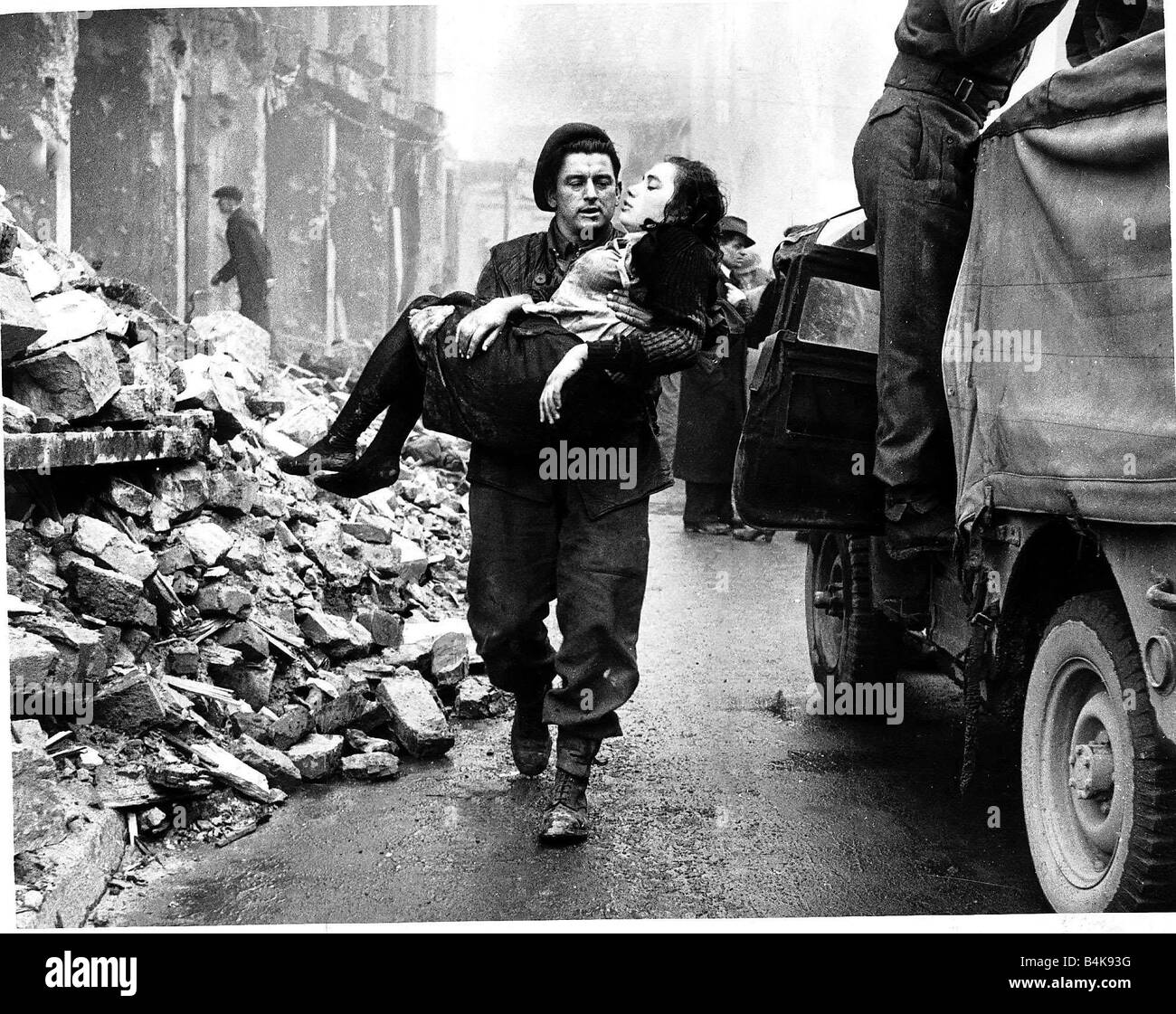 WW2 ll British army rescueing woman 4 45 WW2 Stock Photo - Alamy