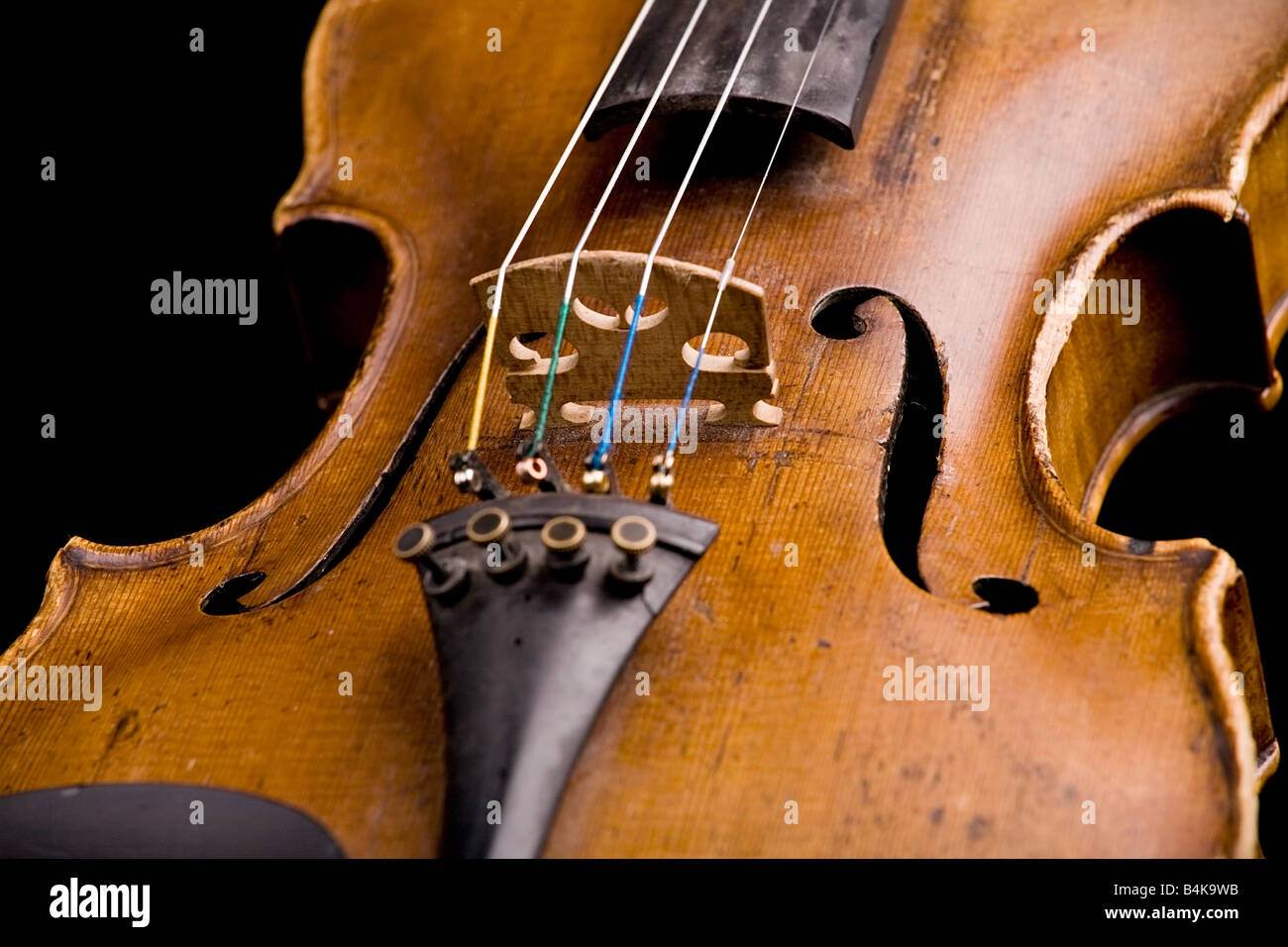 old violin isolated on black background Stock Photo - Alamy