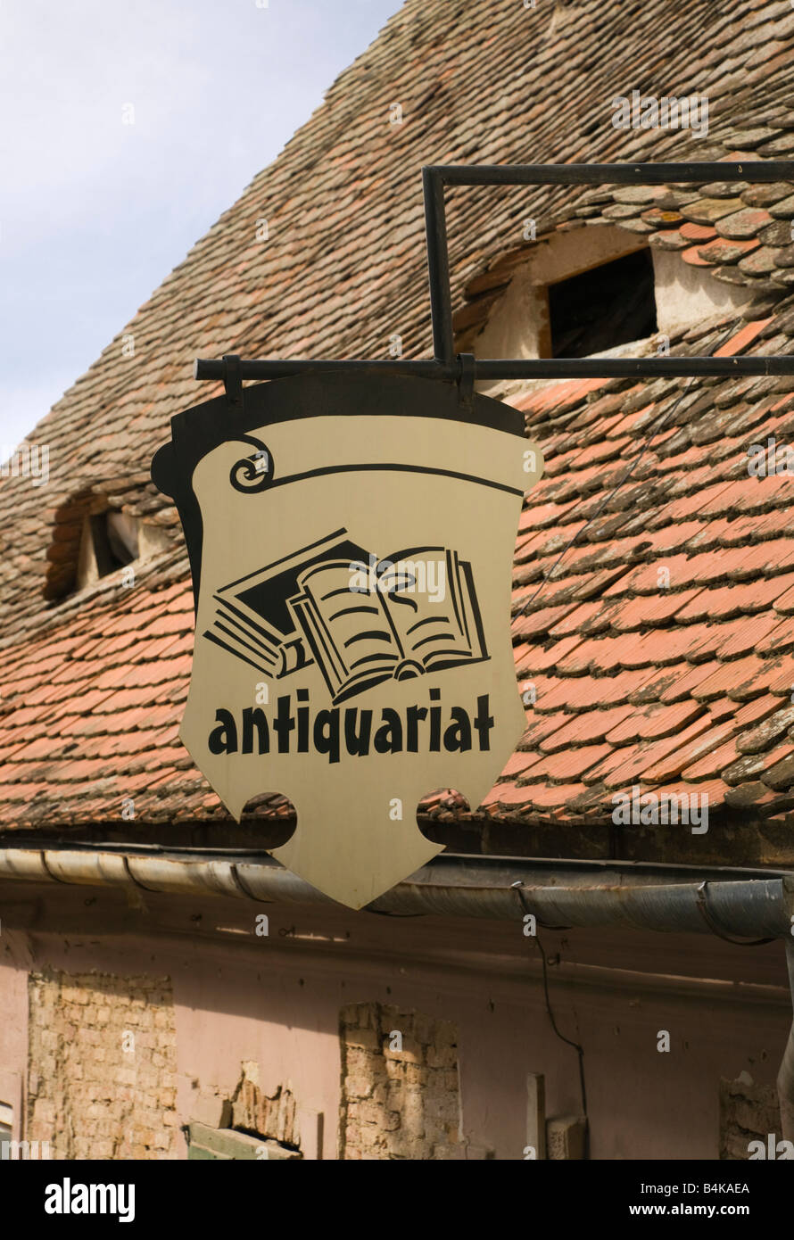 Sibiu Transylvania Romania Europe Antique shop sign on tiled roof of ...