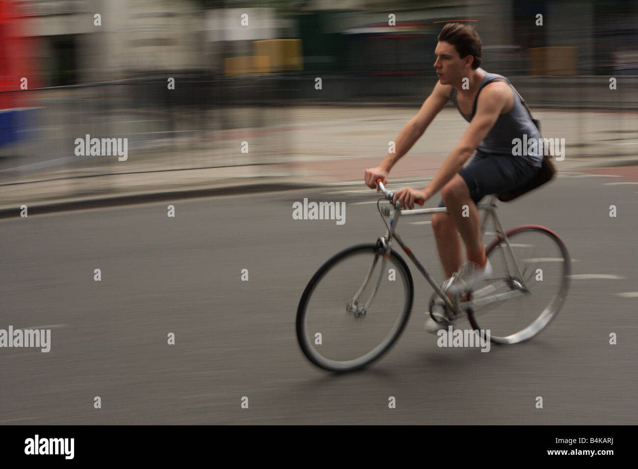 Man cycling with no helmet through central London, UK Stock Photo - Alamy