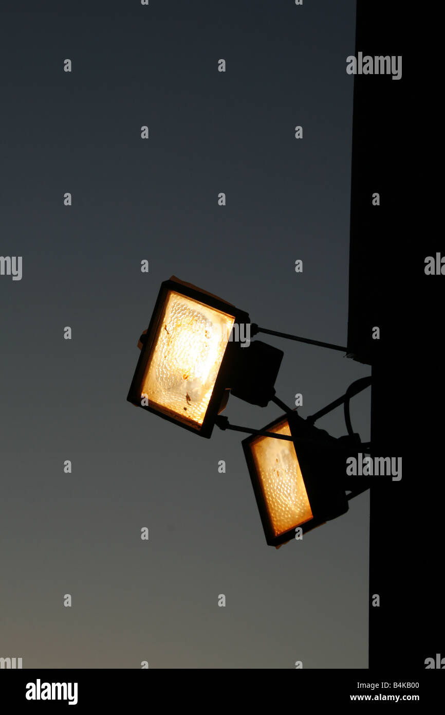 two security lights on building side wall at night Stock Photo - Alamy