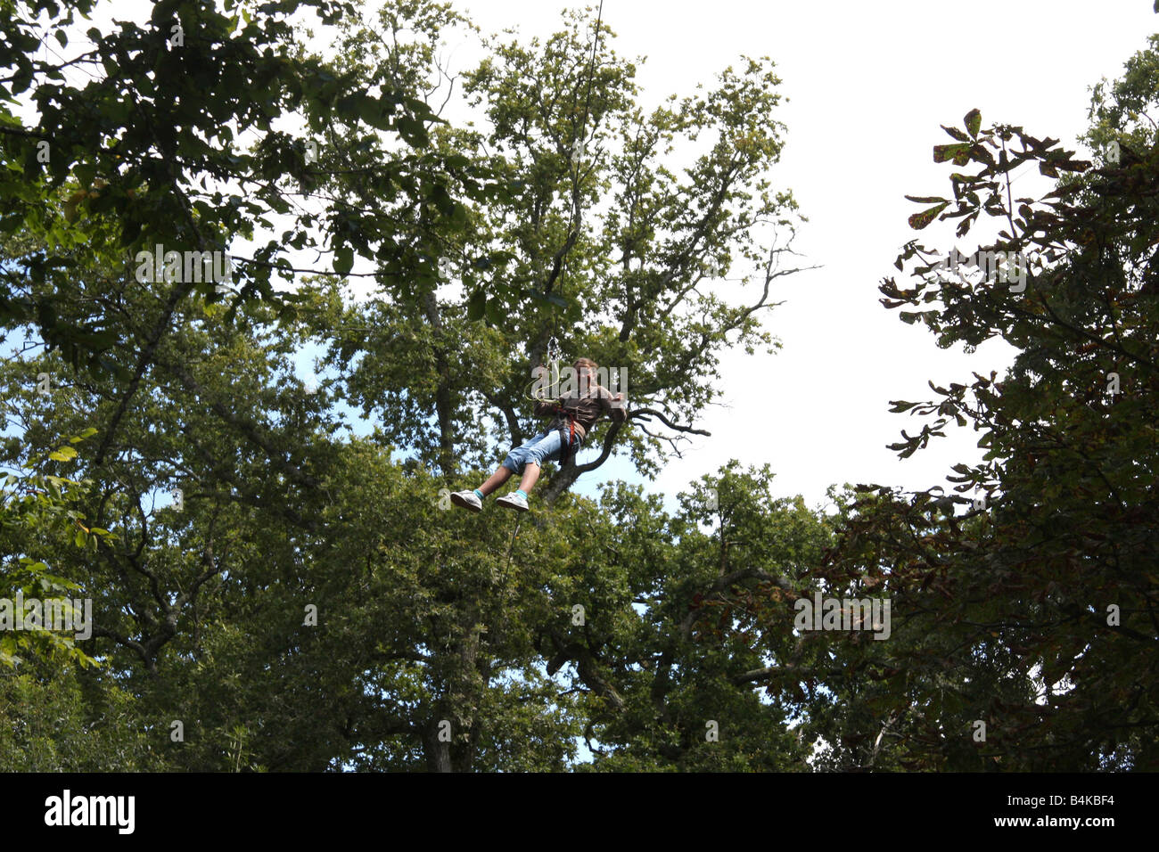 Girl on a zip wire Stock Photo - Alamy