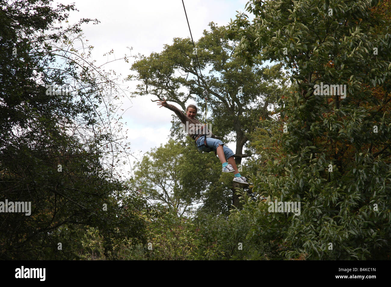 Girl on a zip wire Stock Photo - Alamy