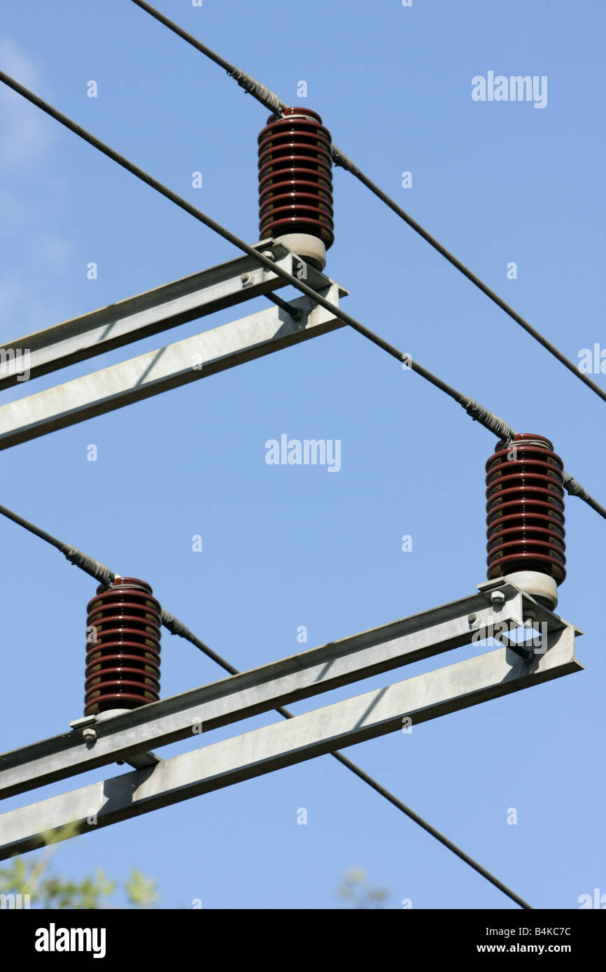 Power lines passing through insulators Stock Photo - Alamy