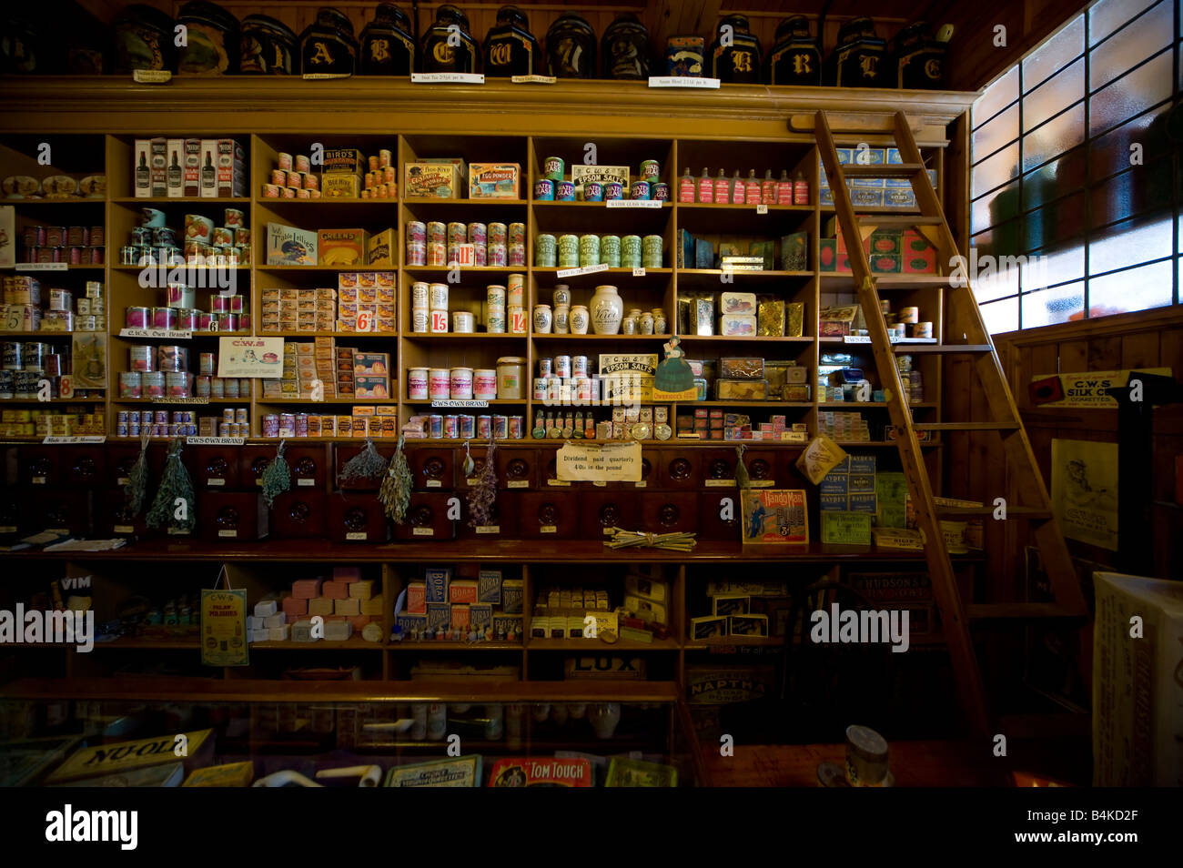 Shelves of goods in a victorian shop at the turn of the 19th century ...
