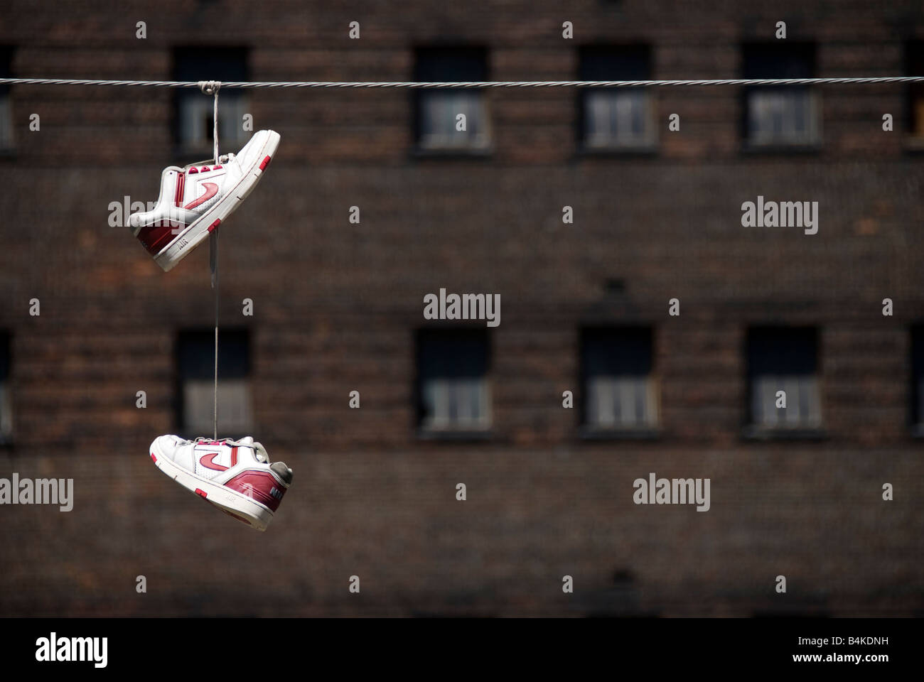 Sneakers hanging telephone wire hi-res stock photography and images - Alamy