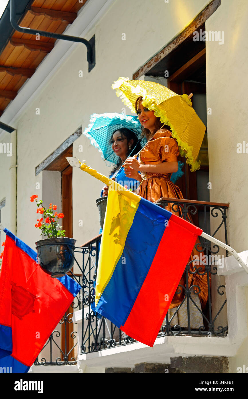 Traditionally-dressed women on balcony, Calle de la Ronda, Quito ...