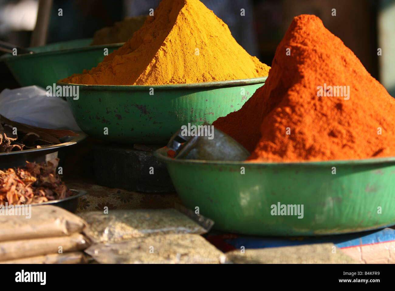 a stall selling paints and dyes at an Indian Market for the Holi ...