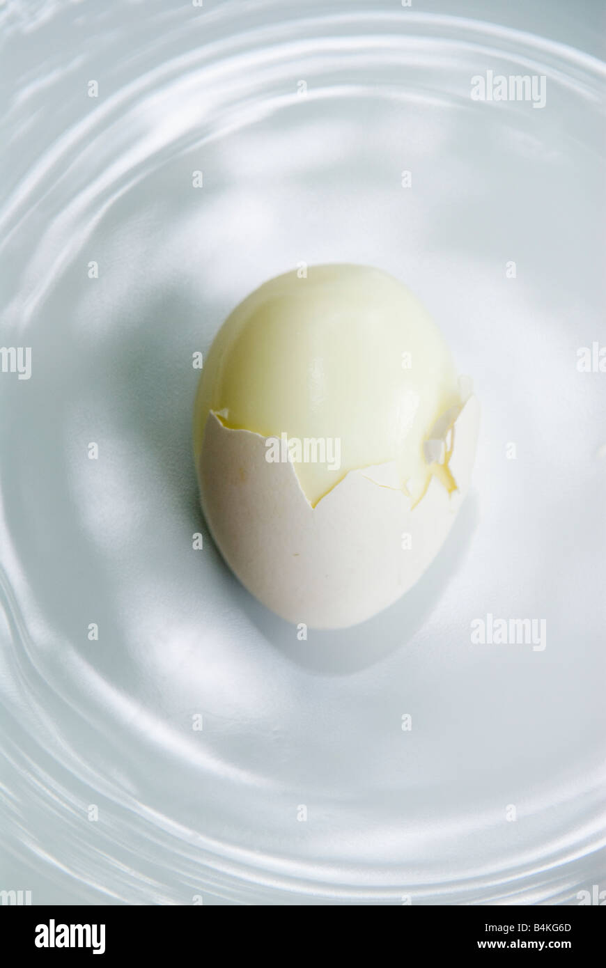 Boiled egg with broken shell Stock Photo - Alamy