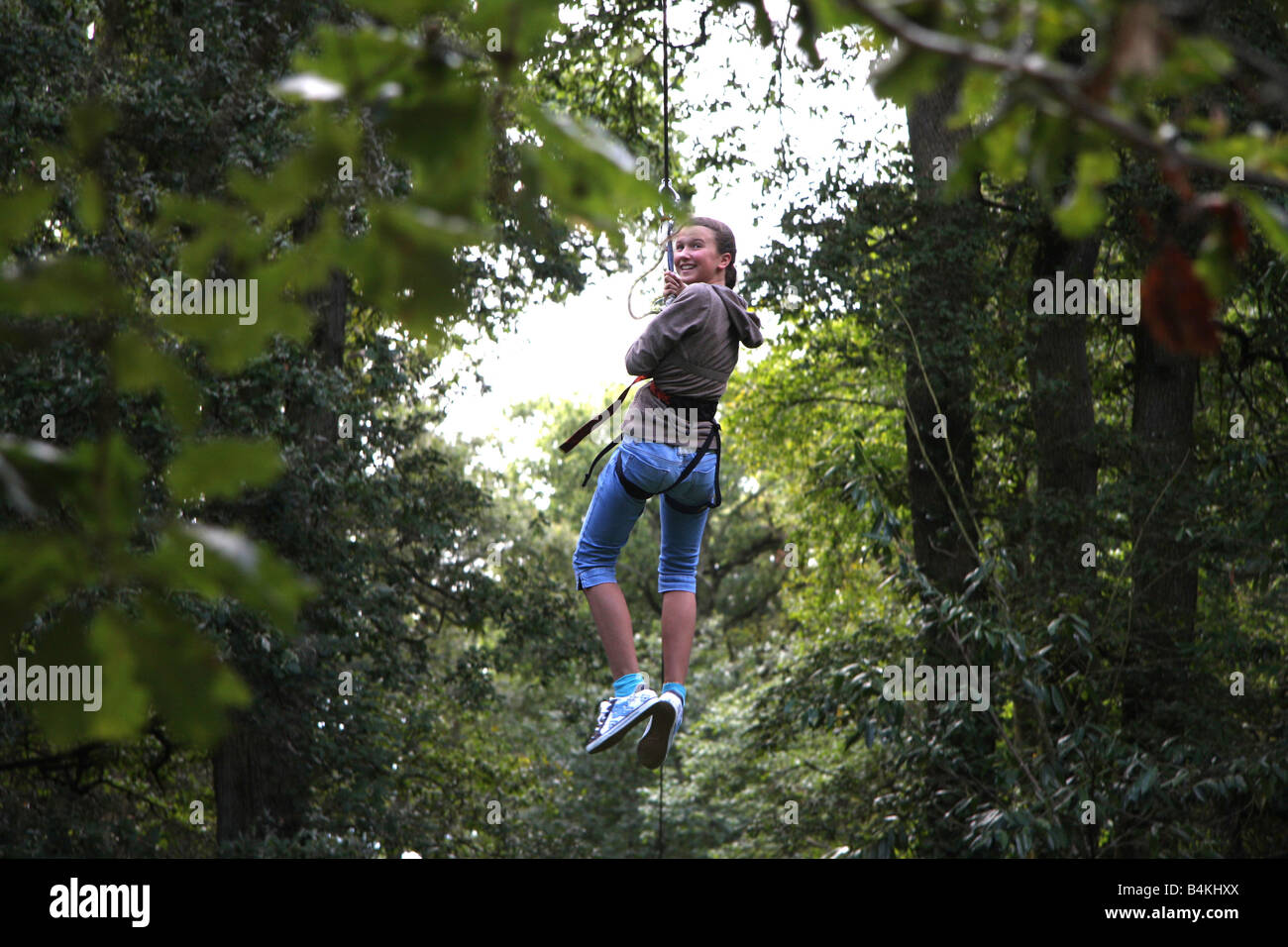 Girl on a zip wire Stock Photo - Alamy