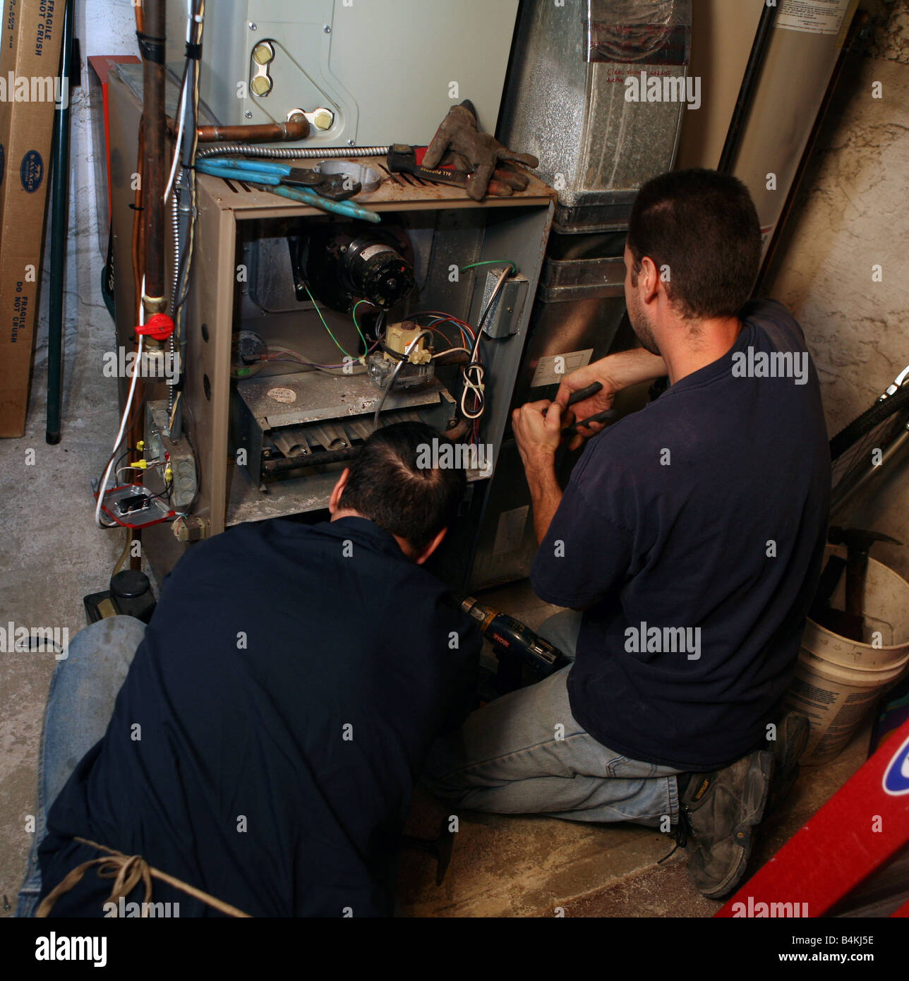 Installation of new high-efficiency gas furnace Stock Photo - Alamy