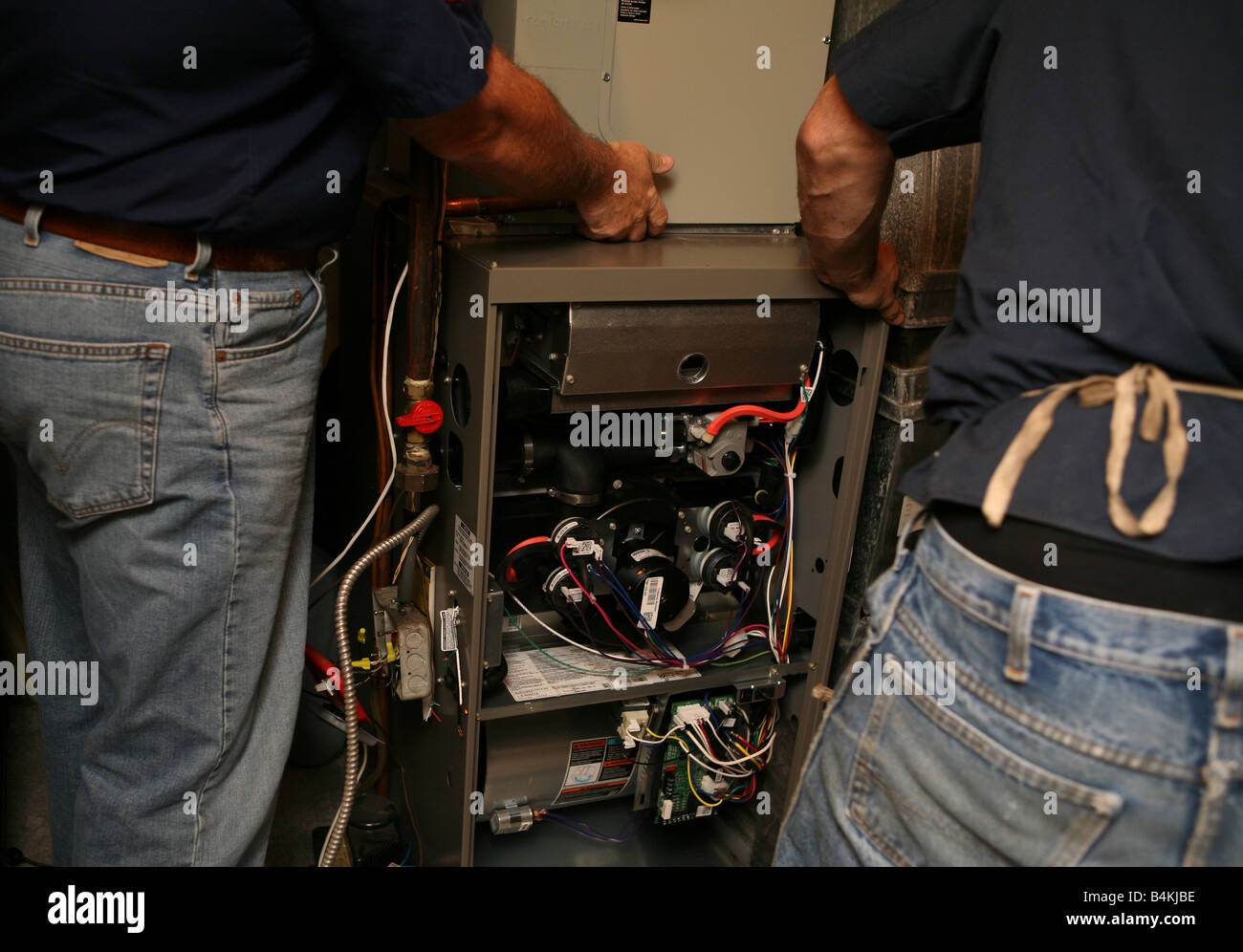Installation of new high-efficiency gas furnace Stock Photo - Alamy