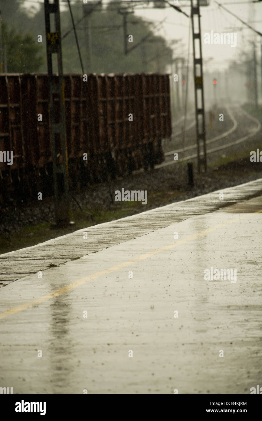 A gloomy rainy evening on a railway platform Stock Photo - Alamy