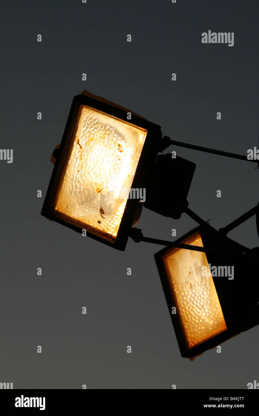 two security lights on building side wall at night Stock Photo - Alamy