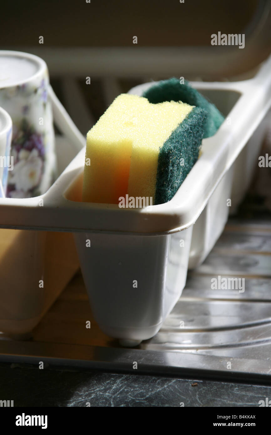 one washing up scourer sponge on kichen sink Stock Photo - Alamy