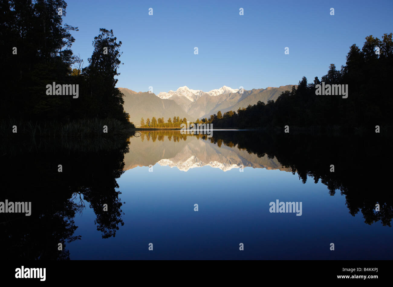 Reflection of Mt Tasman and Mt Cook in Lake Matheson West Coast South ...