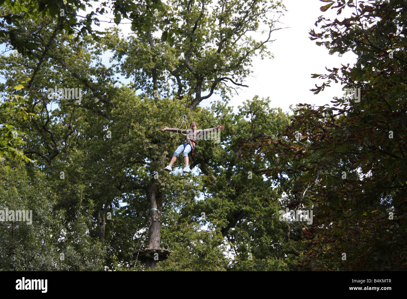 Girl on a zip wire Stock Photo - Alamy