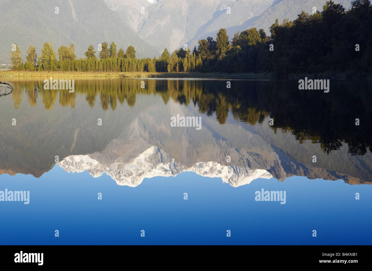 Reflection of Mt Tasman and Mt Cook in Lake Matheson West Coast South ...